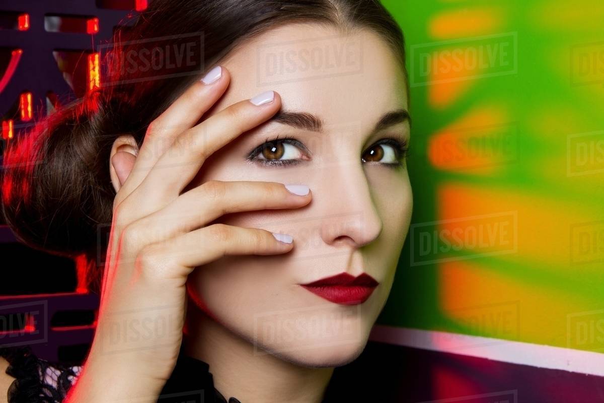 Close up portrait of young woman with hand on face - Royalty-free Stock ...