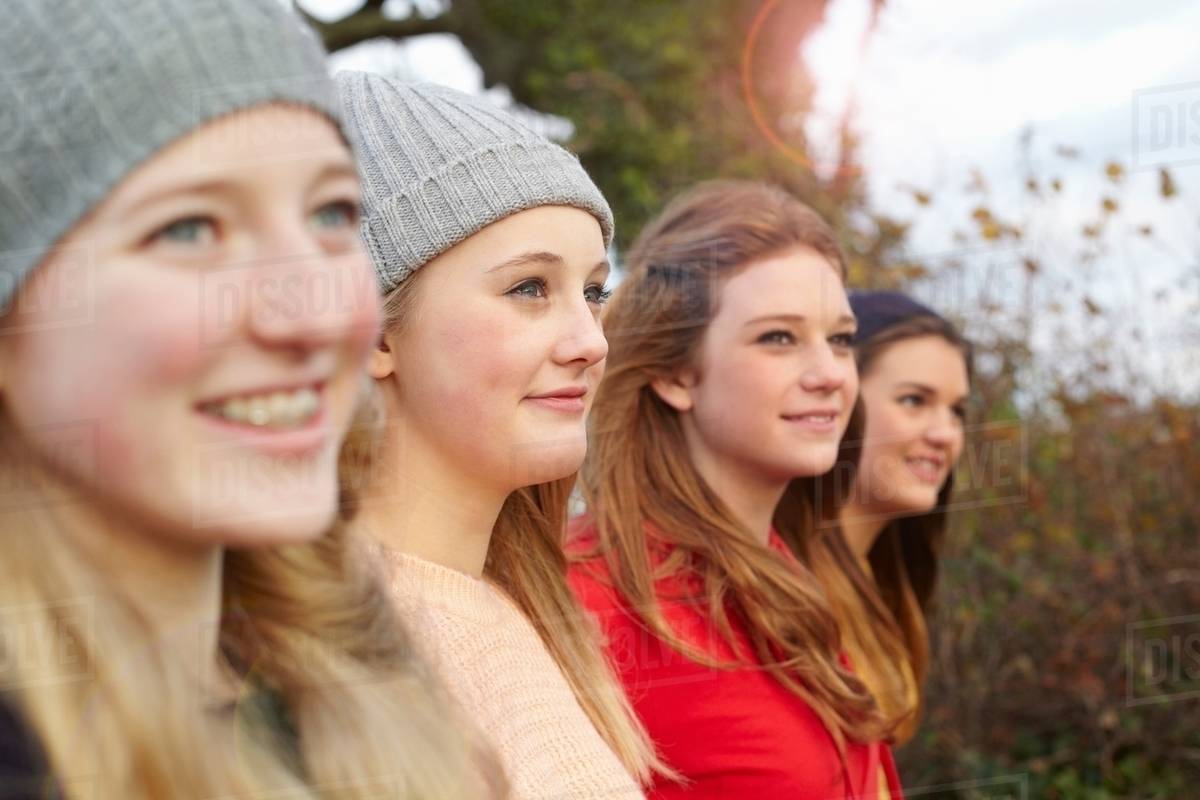 Close up of four teenage girls outdoors - Stock Photo - Dissolve