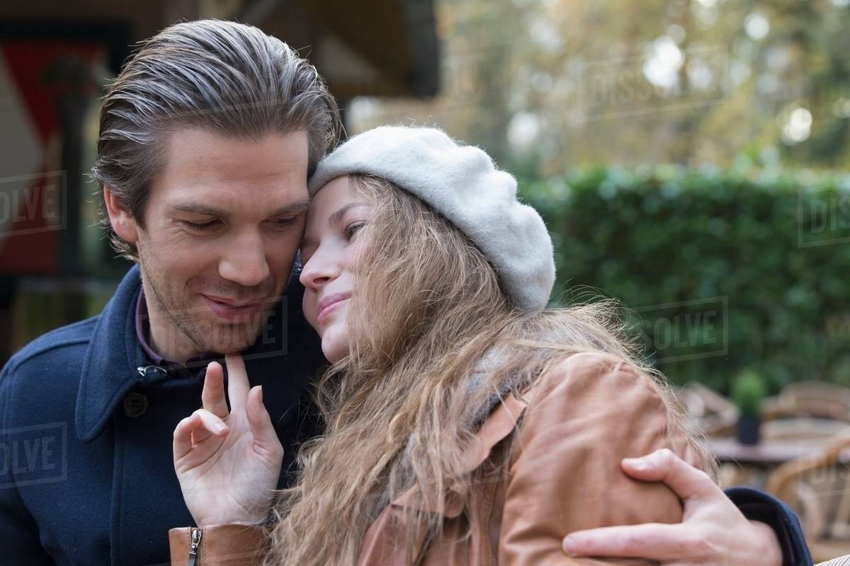 Couple hugging, arm around - Royalty-free Stock Photo | Dissolve