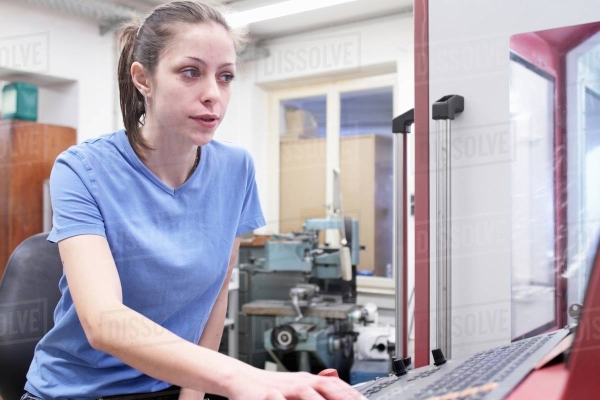 Female engineer working on computer keyboard - Stock Photo - Dissolve