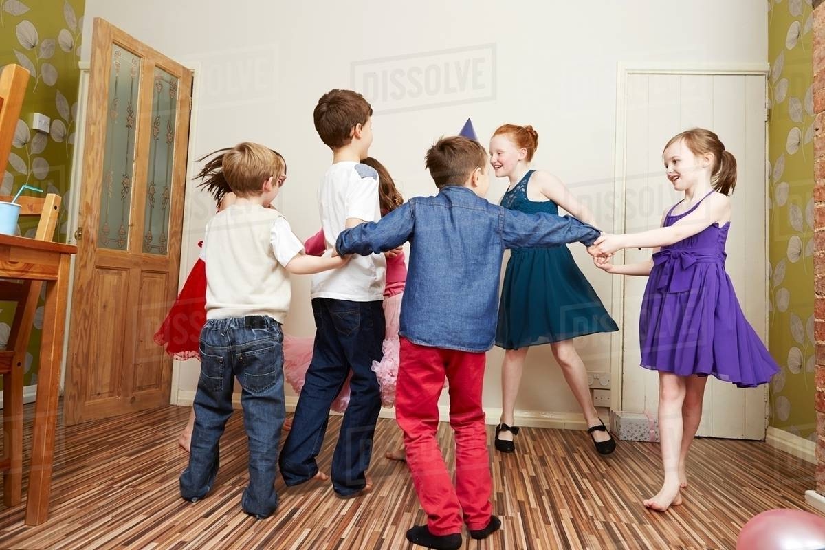 Children dancing at birthday party - Royalty-free Stock Photo | Dissolve