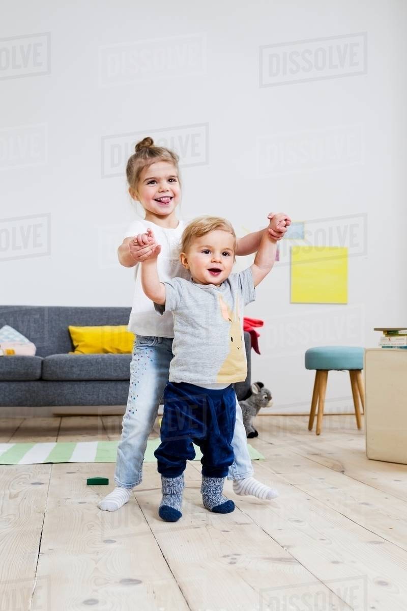 Brother and sister playing at home - Royalty-free Stock Photo | Dissolve