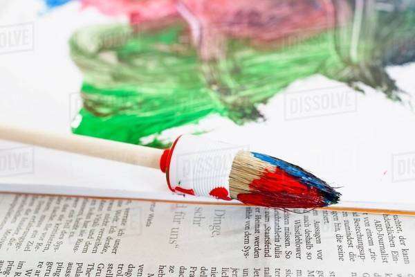 Paint brush, painted paper and newspaper - Royalty-free Stock Photo ...