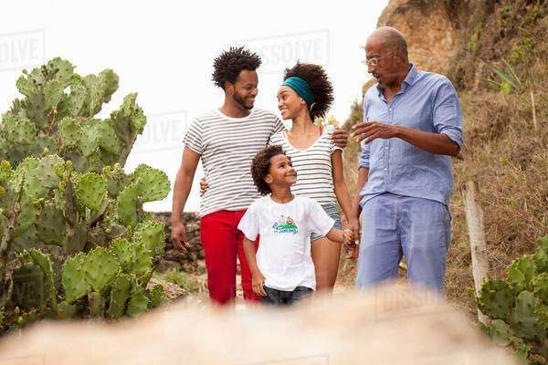 Mature man and family strolling on Ipanema Beach, Rio De Janeiro ...