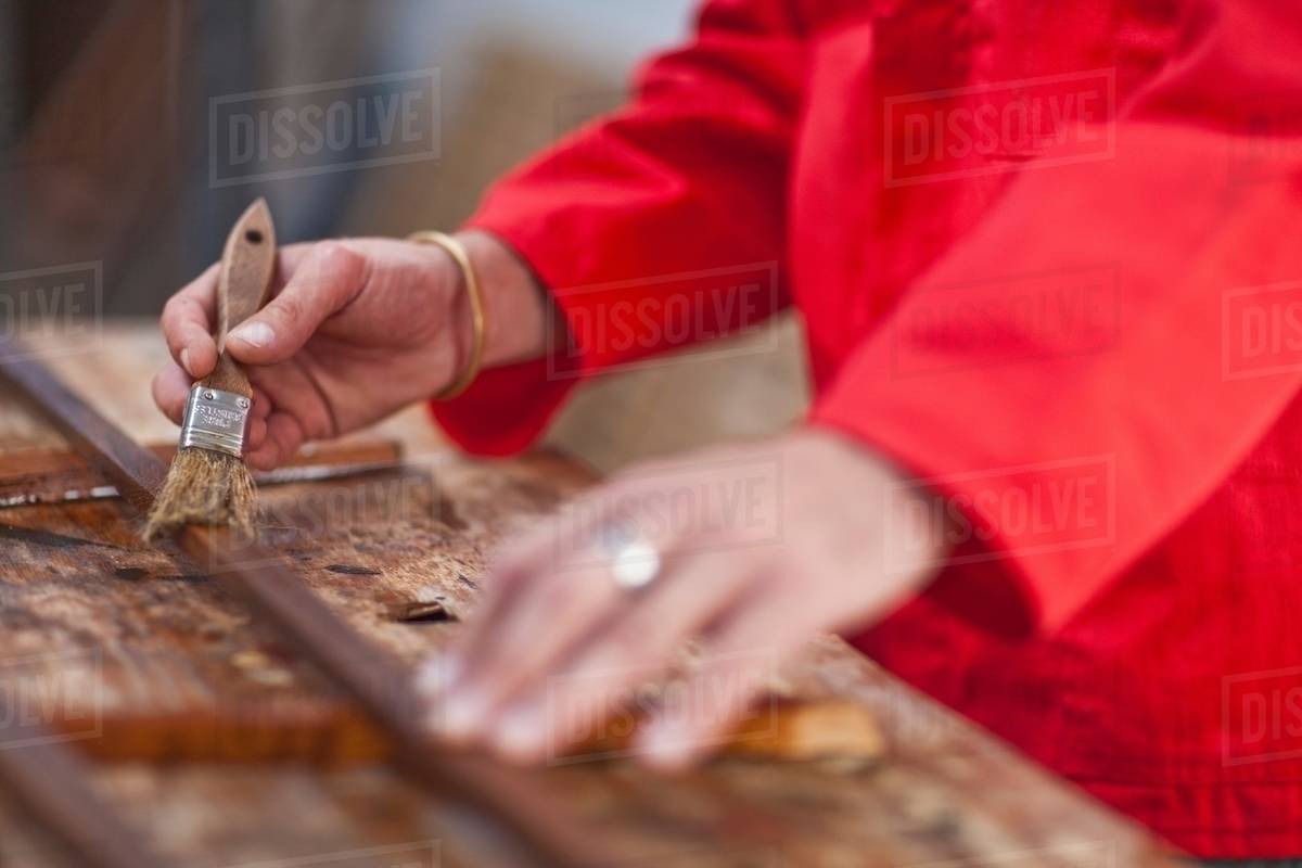 Carpenter varnishing wood, mid section - Royalty-free Stock Photo ...