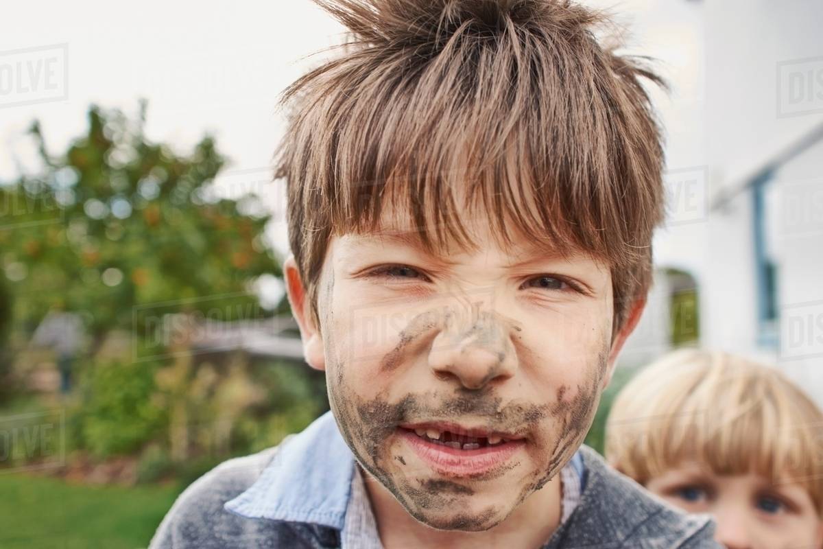 Boy with muddy face - Royalty-free Stock Photo | Dissolve