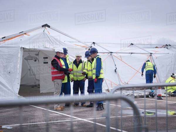Emergency Response Team workers training in control centre tent - Stock ...