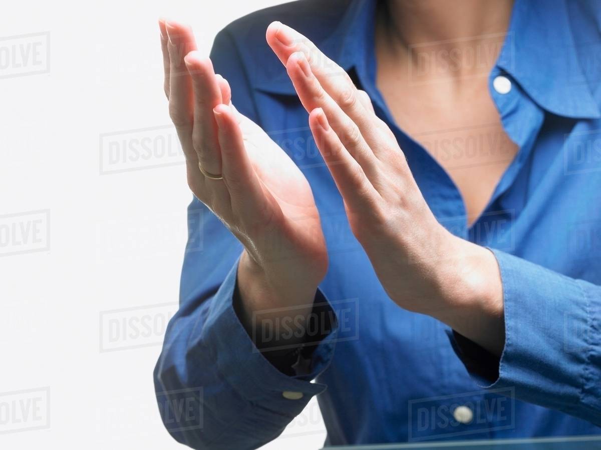 Hands of a woman, applauding - Stock Photo - Dissolve