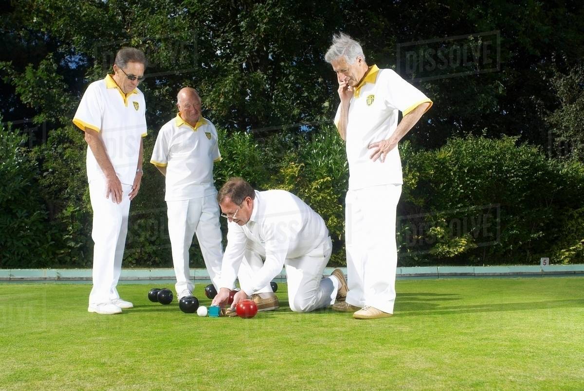 Referee measuring bowls - Royalty-free Stock Photo | Dissolve