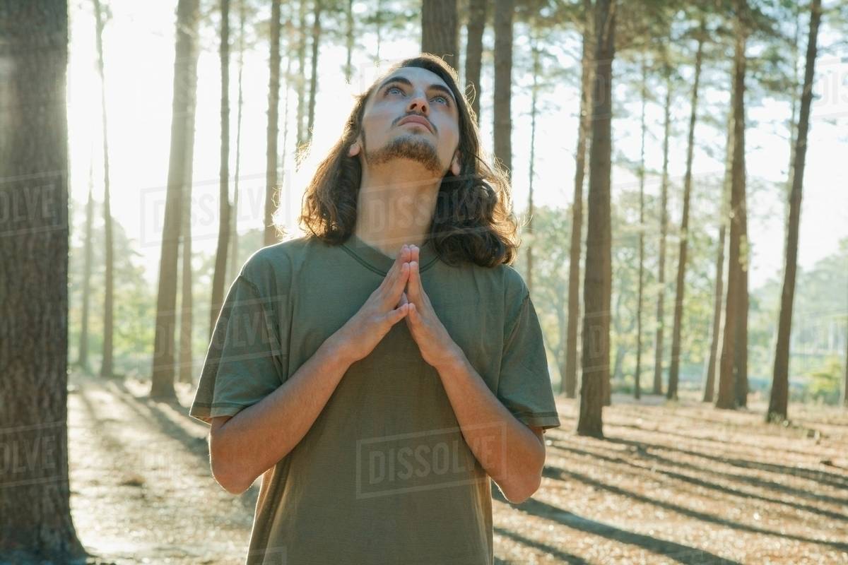 Man standing in forest - Royalty-free Stock Photo | Dissolve