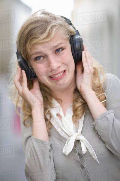Young woman hearing music - Royalty-free Stock Photo | Dissolve