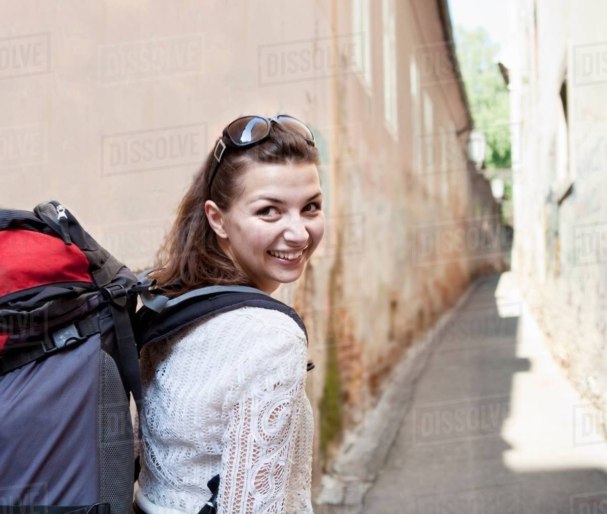 Young woman travelling with backpack - Royalty-free Stock Photo | Dissolve