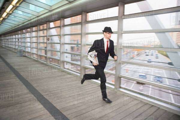 Man running over bridge - Stock Photo - Dissolve