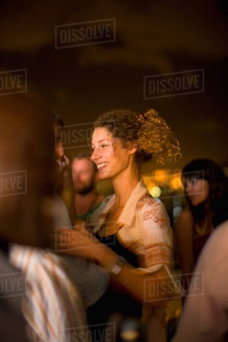 Couple dancing at party at night - Royalty-free Stock Photo | Dissolve