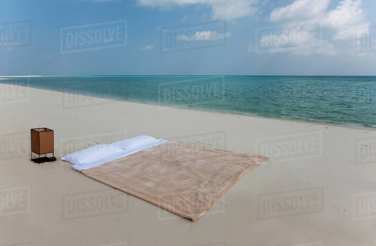 Bed made on tropical beach - Royalty-free Stock Photo | Dissolve