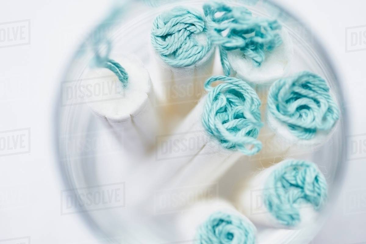 Close up of tampons in glass - Royalty-free Stock Photo | Dissolve