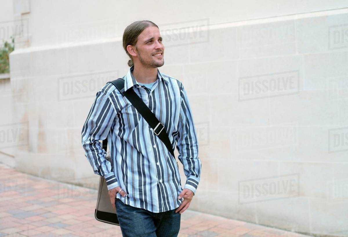 Man walking on city street - Royalty-free Stock Photo | Dissolve