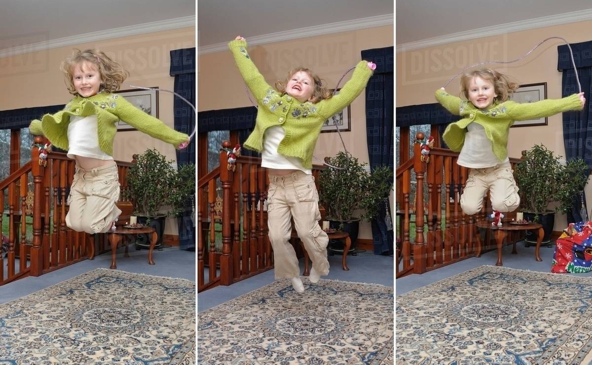 Triptych of girl jumping in house - Royalty-free Stock Photo | Dissolve