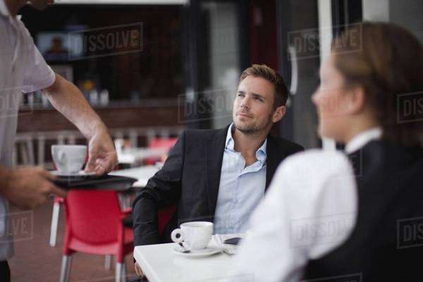 Business people having coffee together - Royalty-free Stock Photo ...