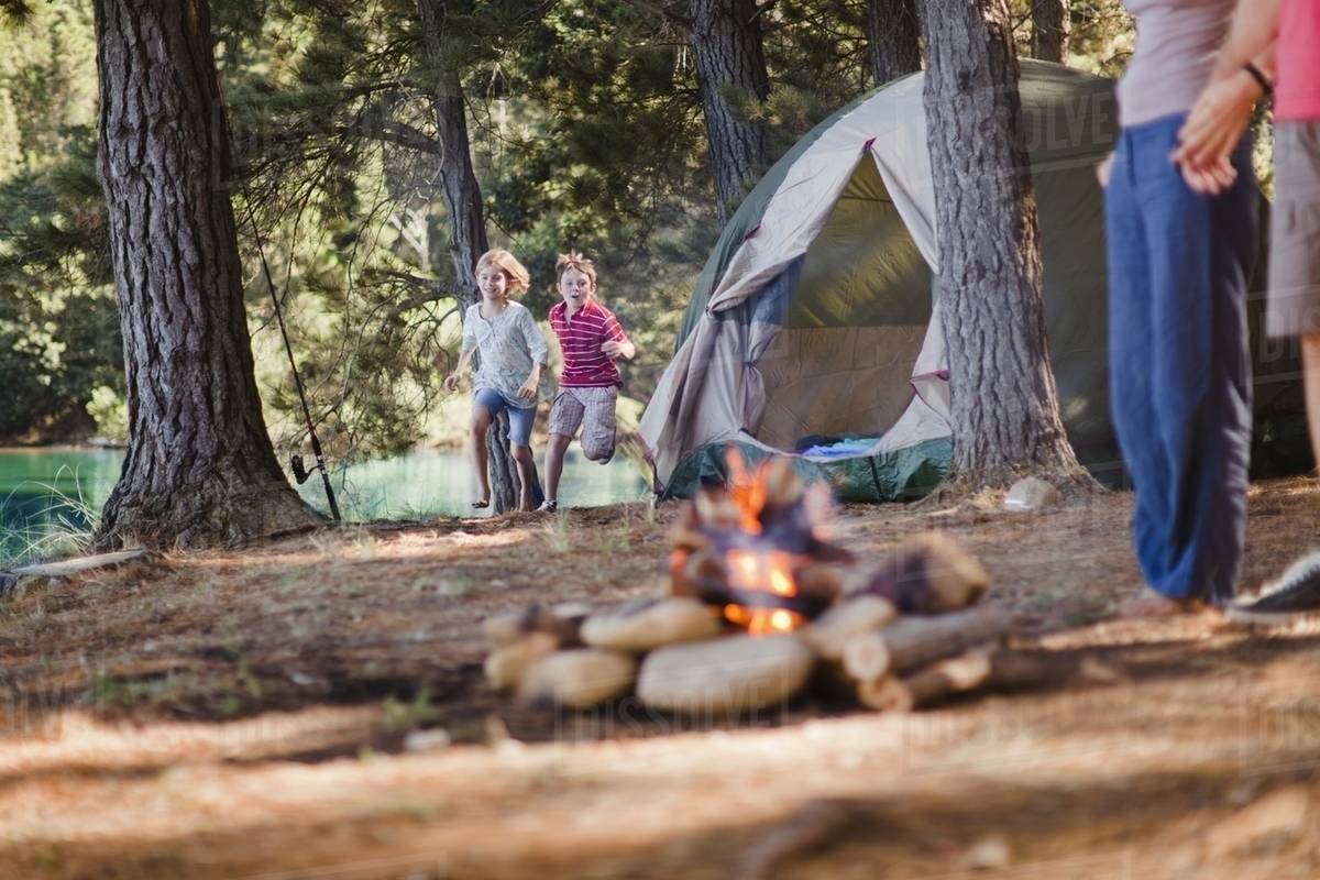 Children playing in campsite - Royalty-free Stock Photo | Dissolve