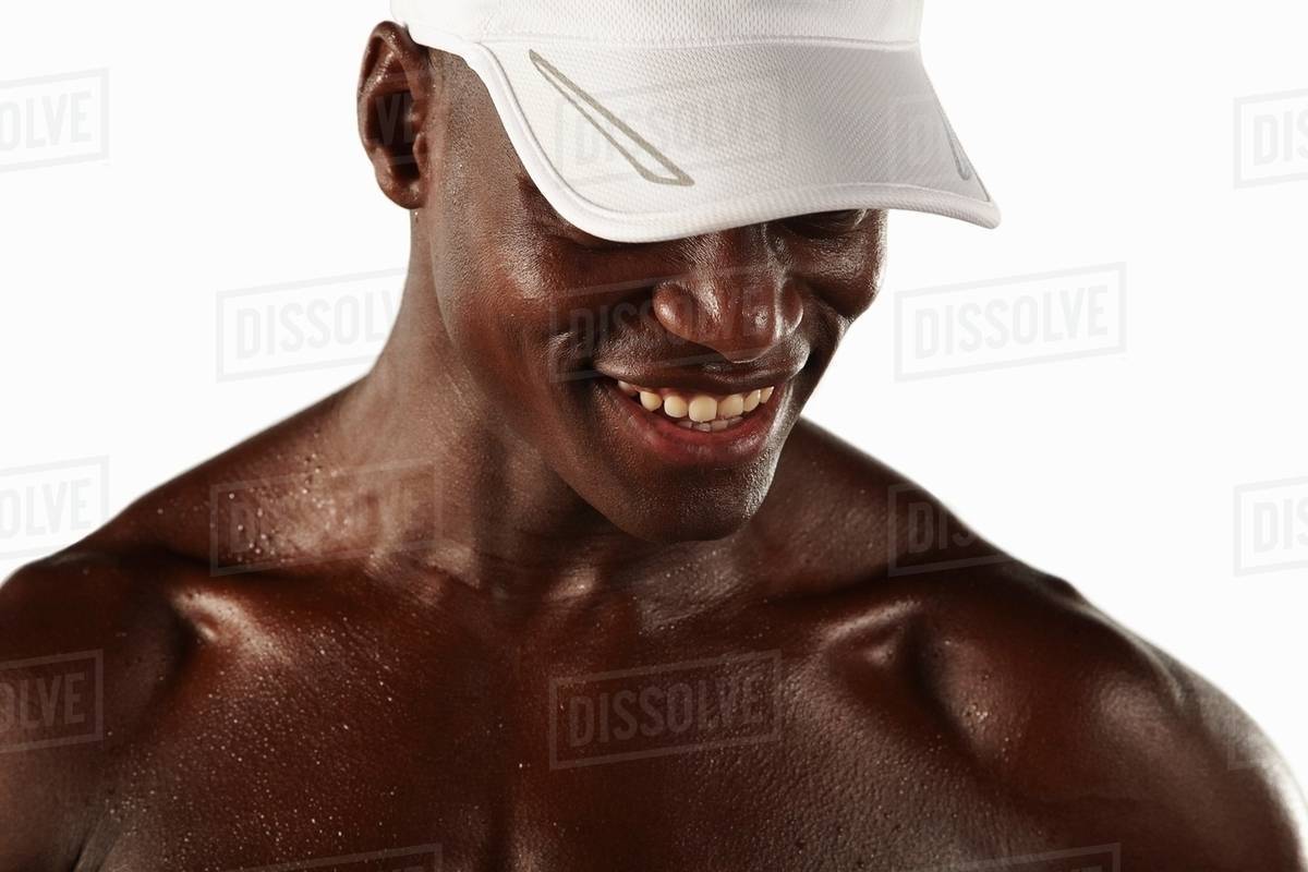 Sweaty athlete smiling - Royalty-free Stock Photo | Dissolve