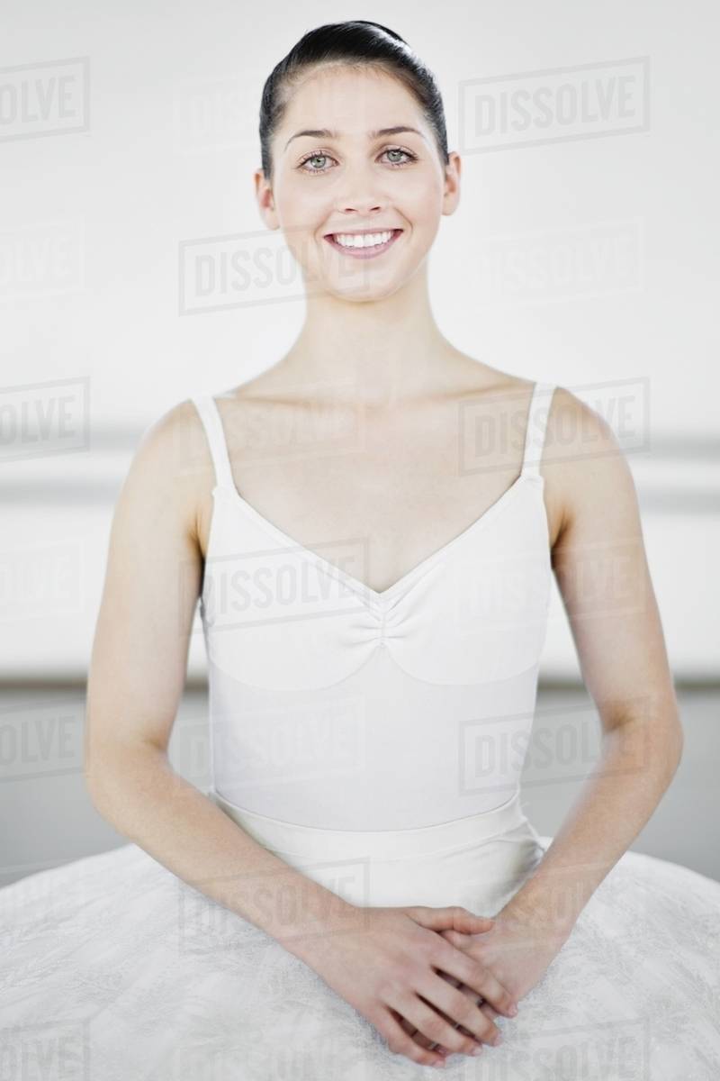Ballet dancer smiling in studio - Royalty-free Stock Photo | Dissolve