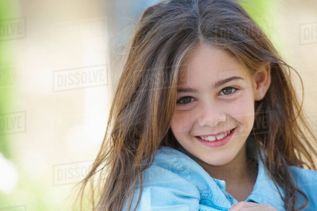 Close up of girl's smiling face - Stock Photo - Dissolve