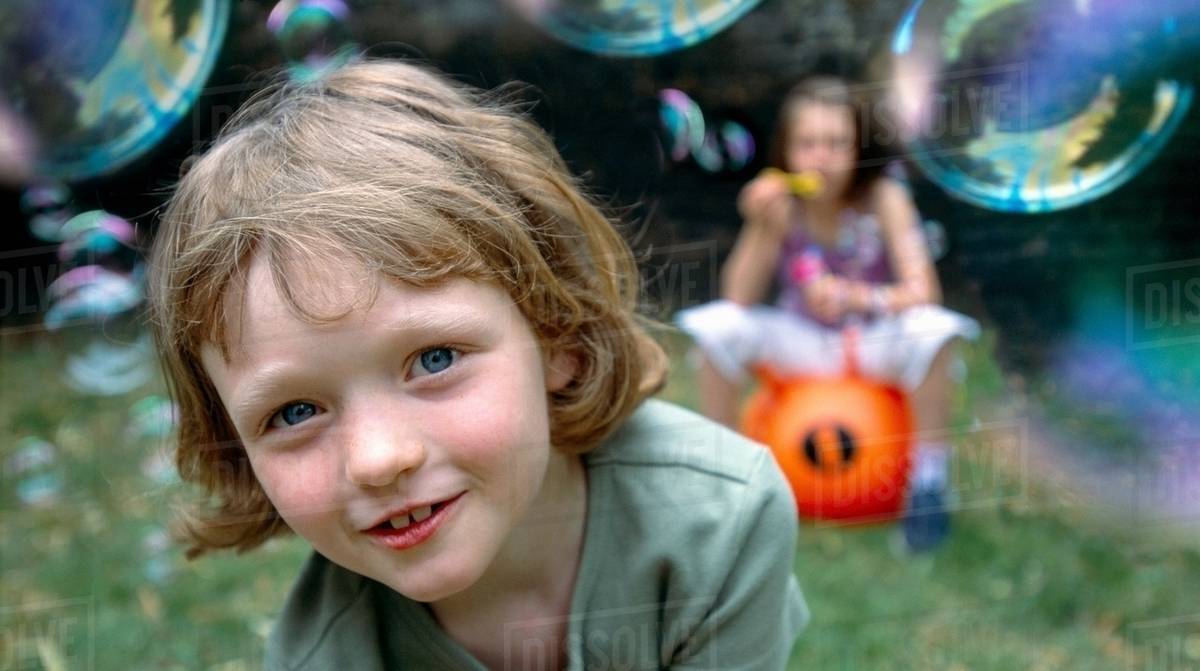 Children playing with bubbles outdoors - Royalty-free Stock Photo ...