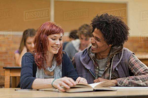 Students working together in class - Royalty-free Stock Photo | Dissolve
