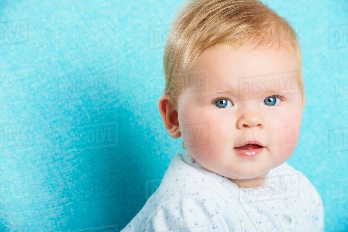 Close up of infants face - Stock Photo - Dissolve