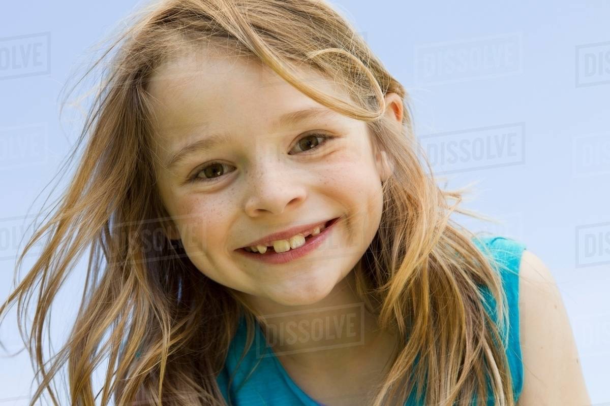 Close up of girls smiling face - Royalty-free Stock Photo | Dissolve