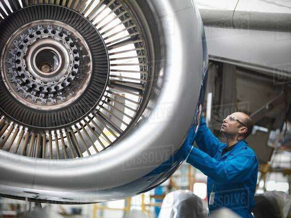 Aircraft engineer working on 737 jet engine in airport - Stock Photo ...