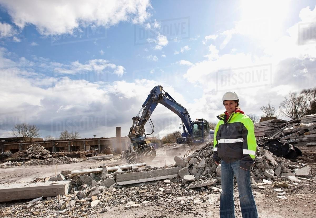 Worker standing on construction site - Stock Photo - Dissolve