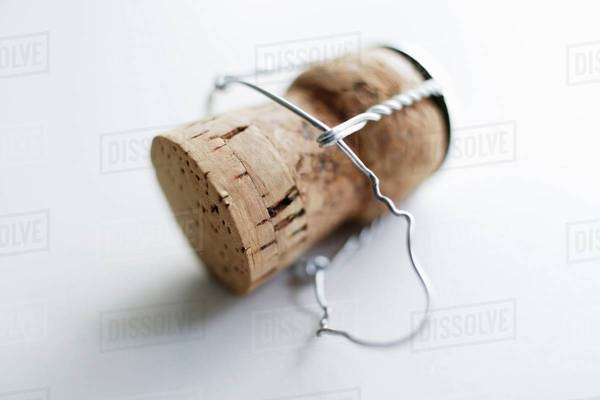 Close up of unscrewed champagne cork - Royalty-free Stock Photo | Dissolve
