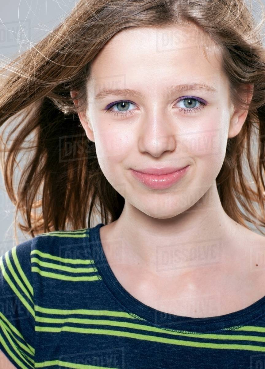 Close up of girls smiling face - Stock Photo - Dissolve