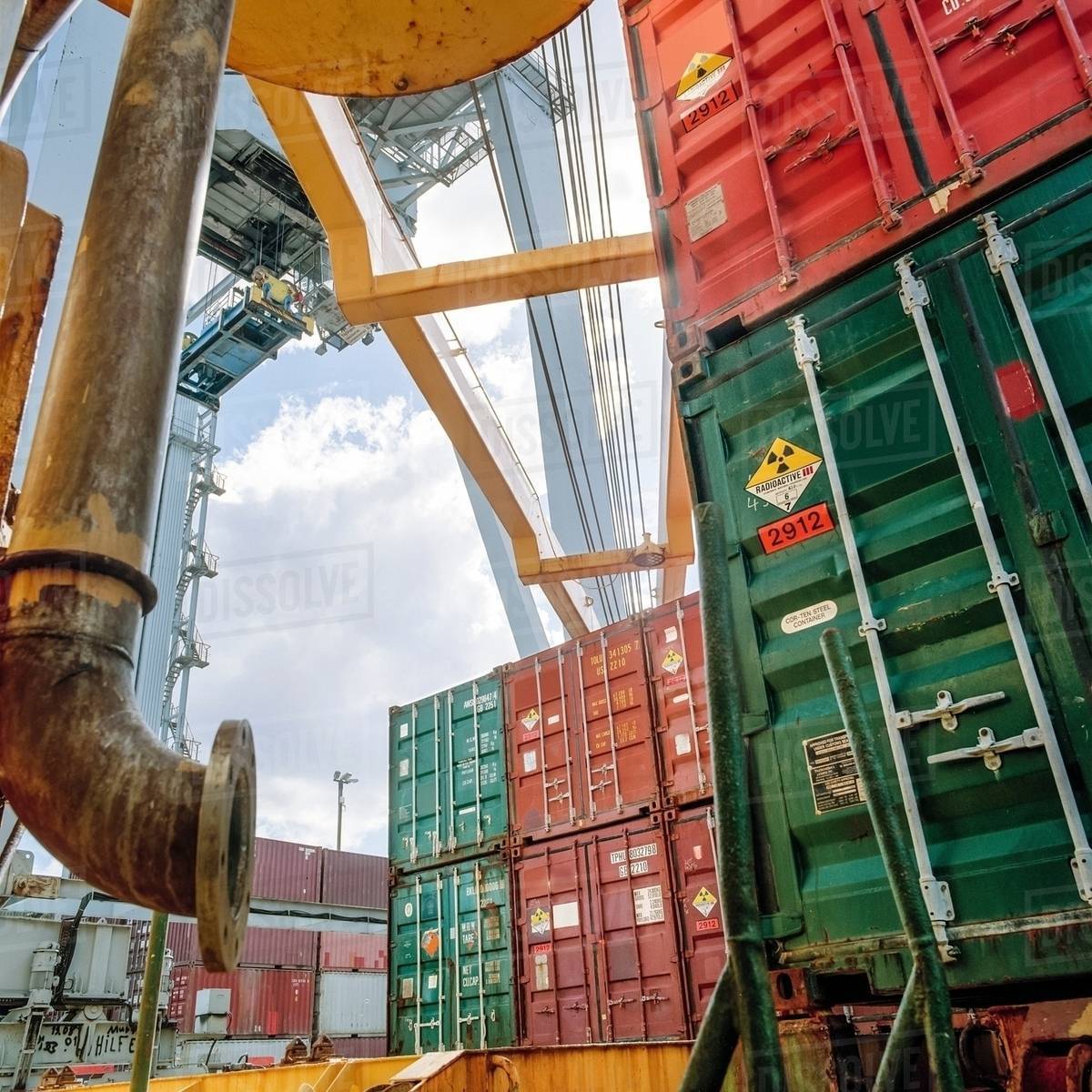 Shipping containers holding uranium ore on container ship, low angle ...