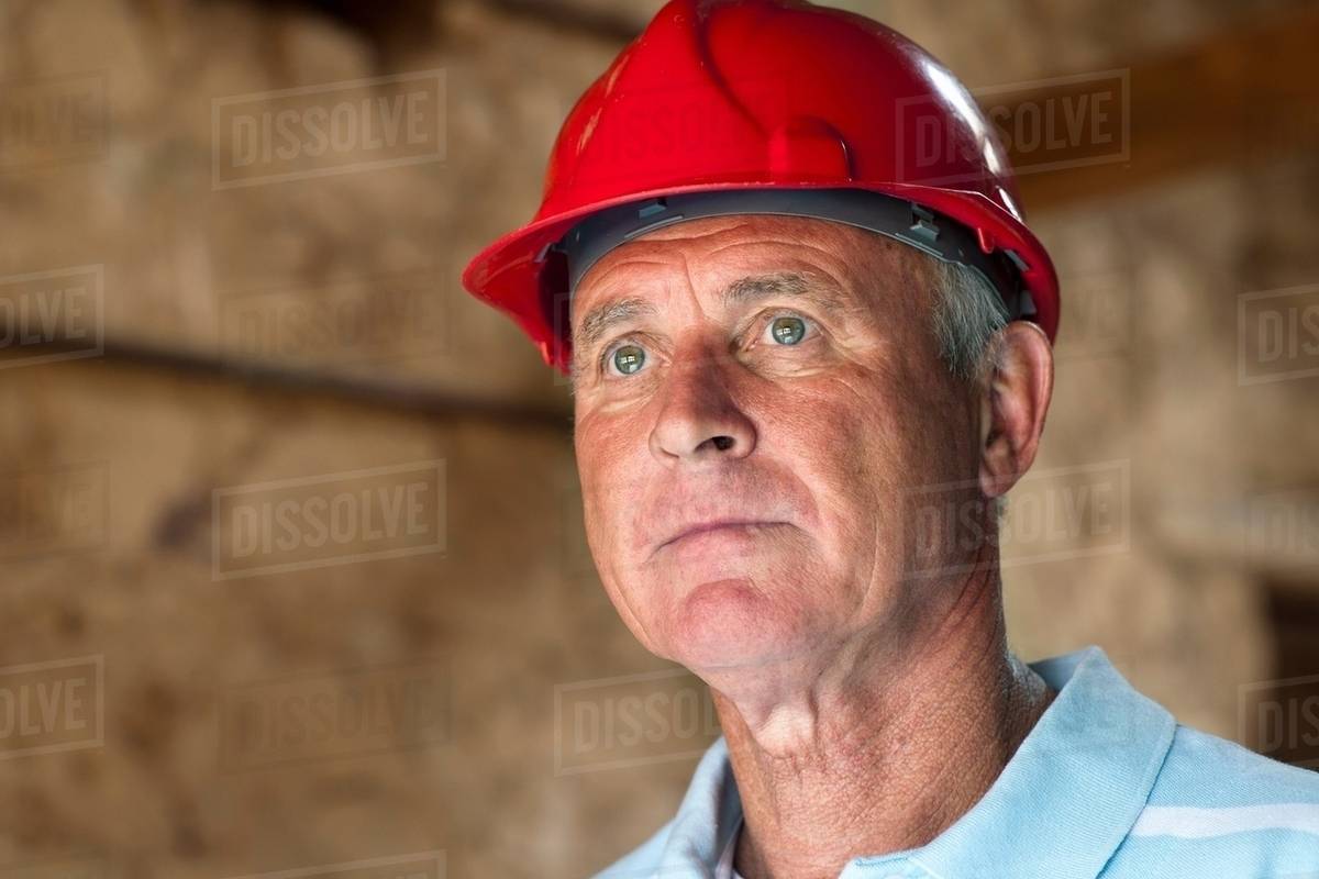 Construction worker wearing hard hat - Royalty-free Stock Photo | Dissolve
