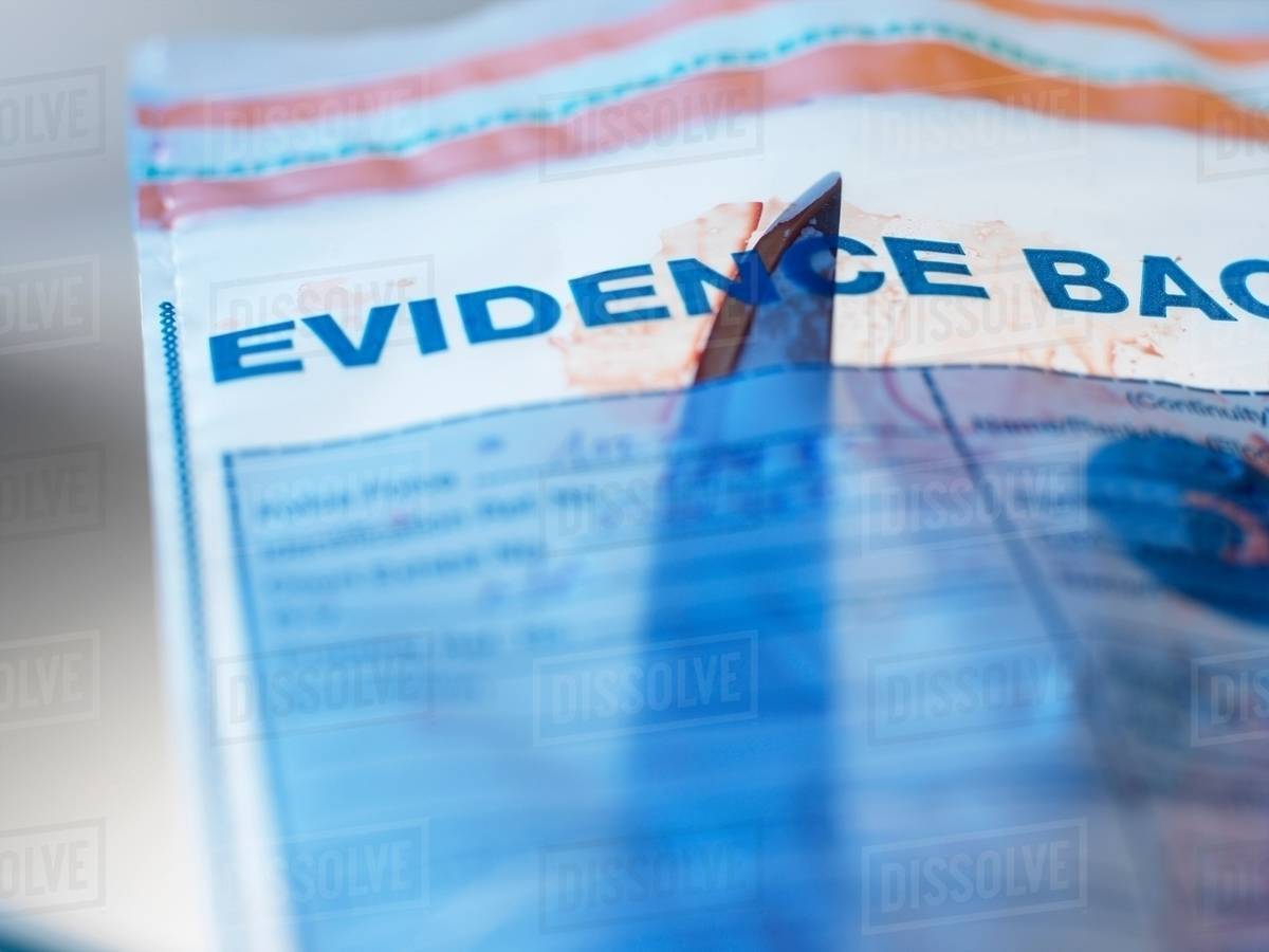 Evidence from knife crime incident in forensic bag - Stock Photo - Dissolve