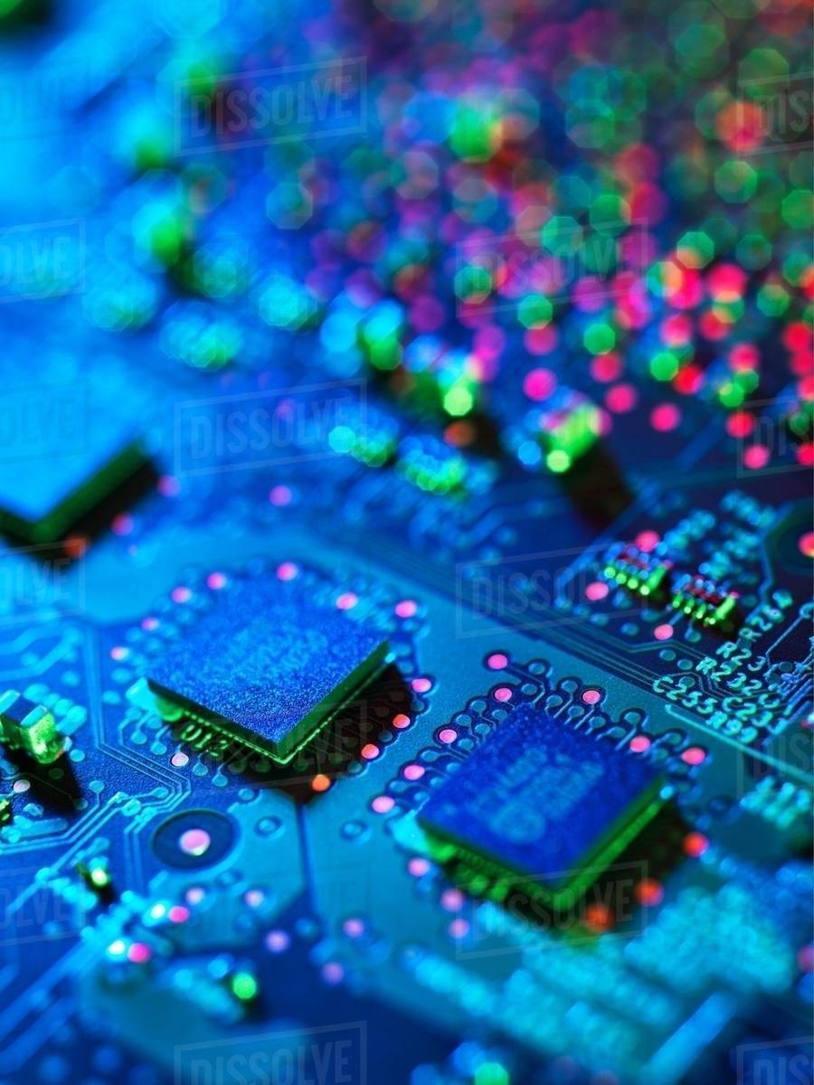 Close up detail of blue computer circuit board - Stock Photo - Dissolve