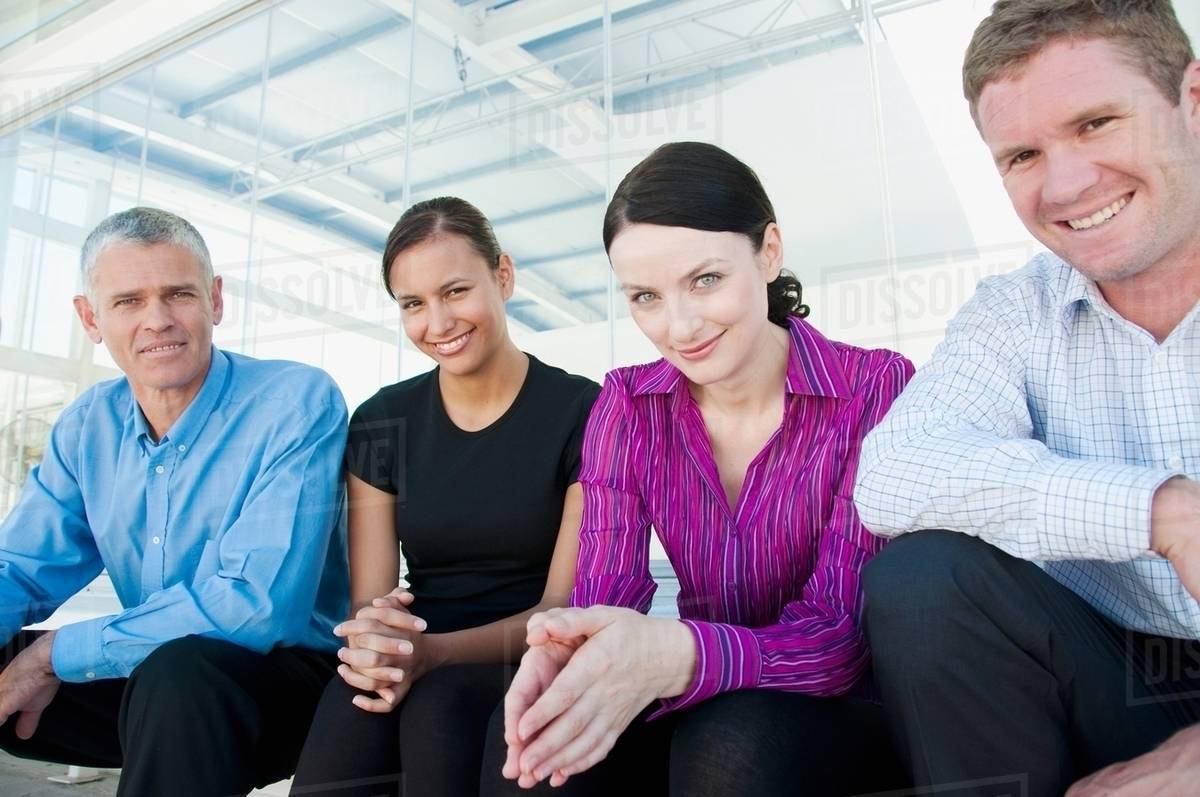 Four happy members of a business team - Royalty-free Stock Photo | Dissolve