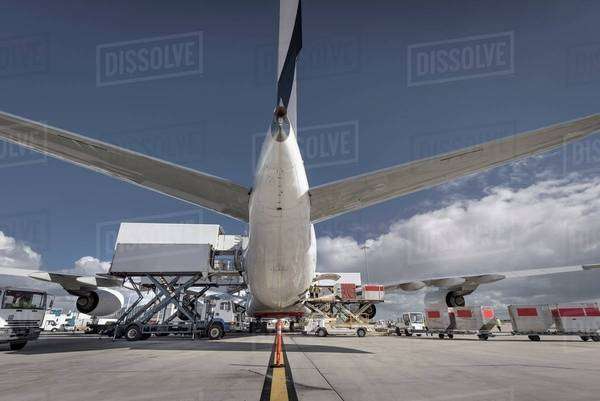 Rear view of A380 jet aircraft being loaded at airport - Stock Photo ...