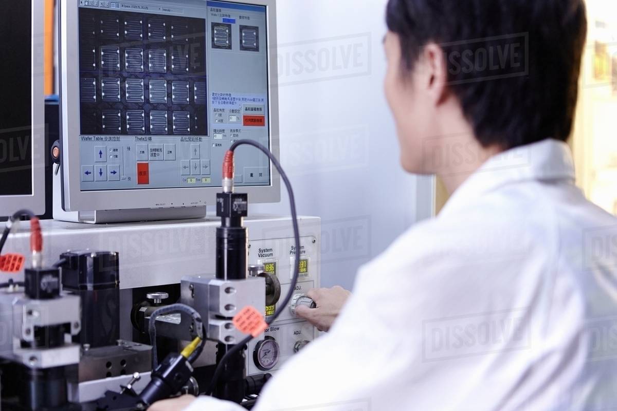 Technician working in LED factory - Stock Photo - Dissolve
