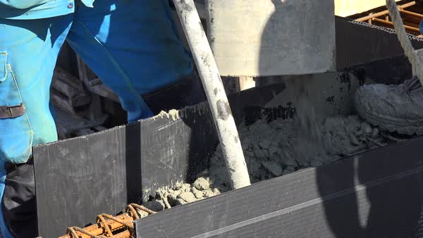 Workflow at the construction site, concrete team work pouring ...