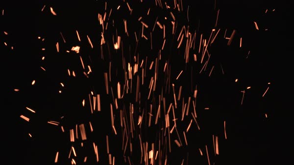 Burning ash rising from large fire in the night sky, maximum amount of ...