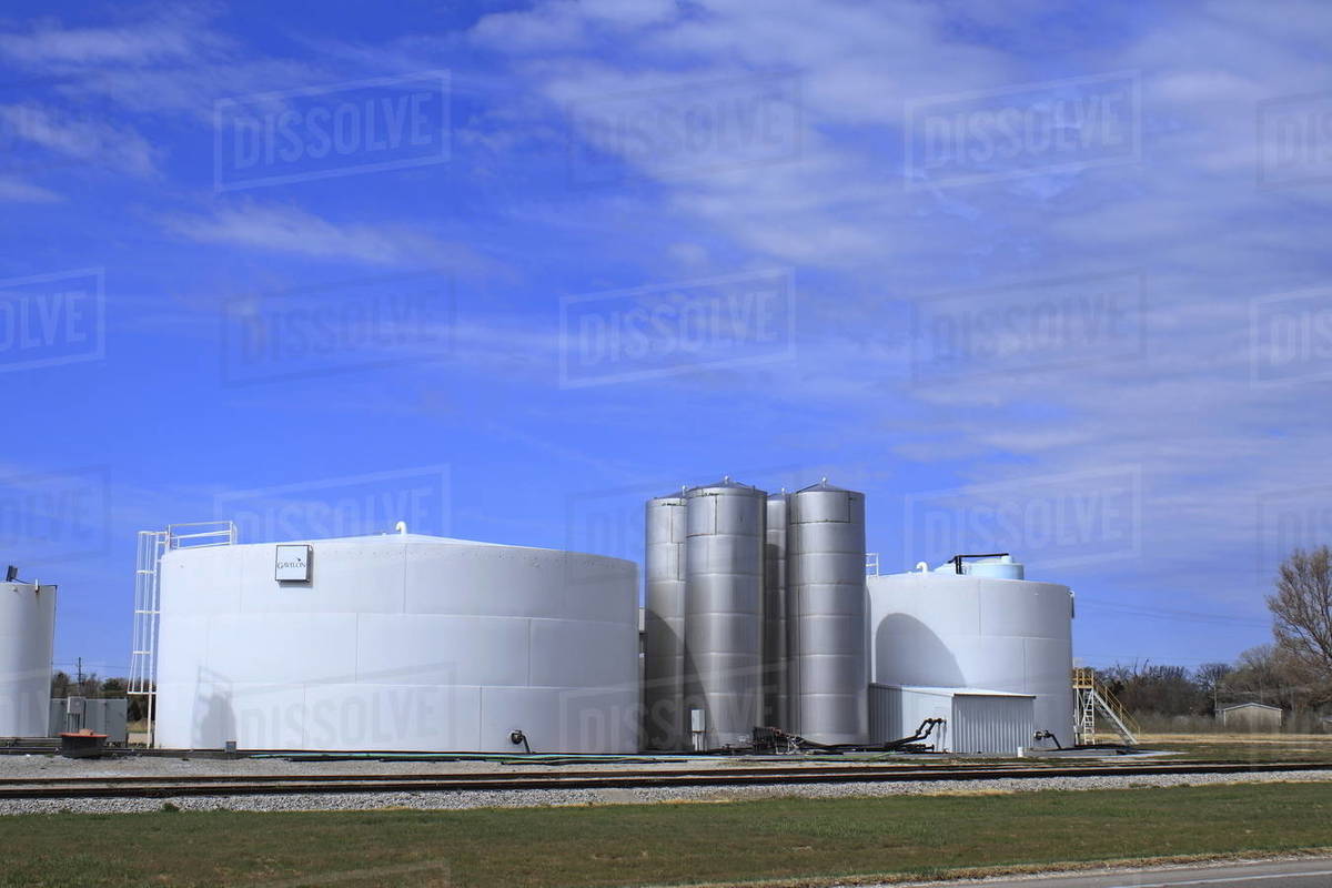 GAVILON fertilizer tanks with blue sky and clouds that's in Nickerson ...