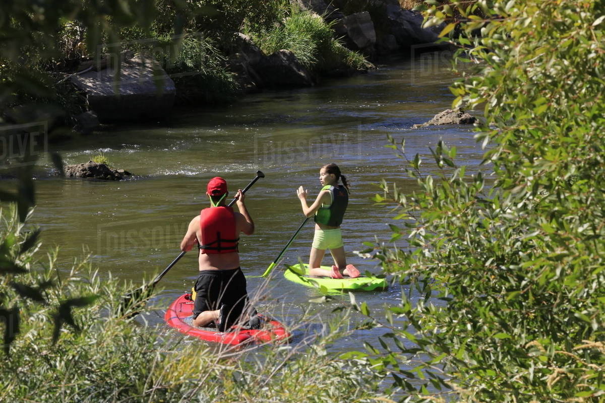 Man and Daughter Paddle Boarding on Weber River by Devil Slide in Utah ...