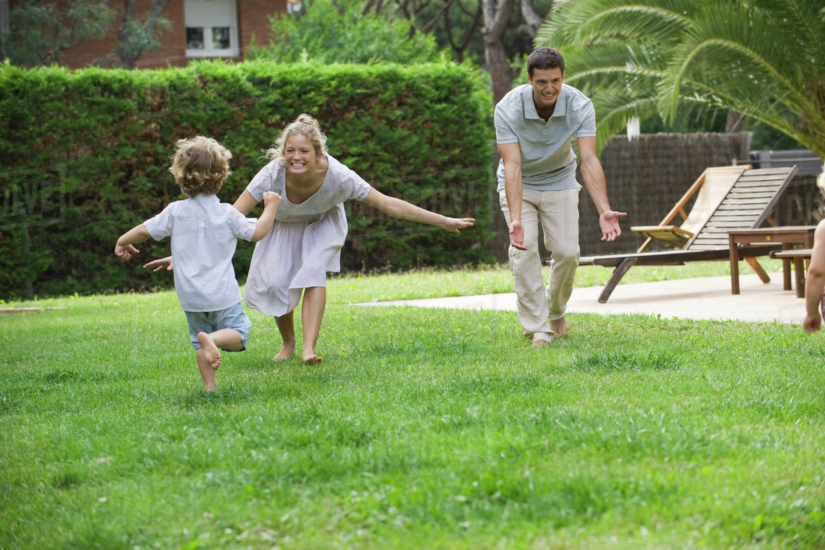 Family having fun together outdoors - Royalty-free Stock Photo | Dissolve