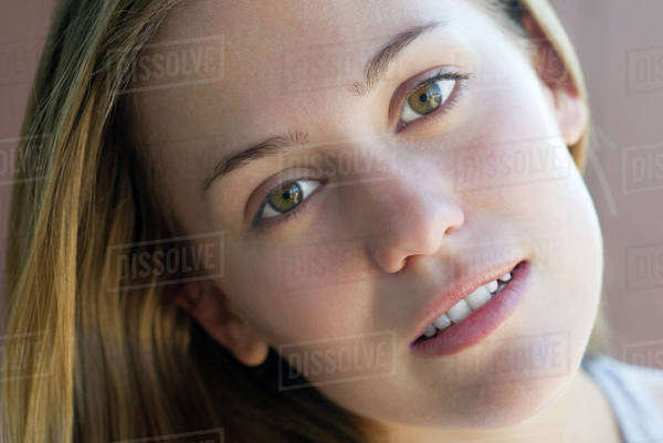 Woman with head tilted, portrait - Royalty-free Stock Photo | Dissolve