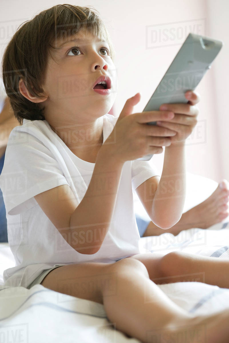 Little boy watching TV - Royalty-free Stock Photo | Dissolve