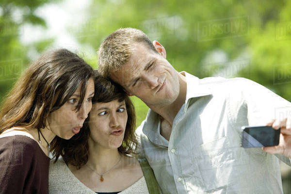 Friends making funny faces for photo - Royalty-free Stock Photo | Dissolve